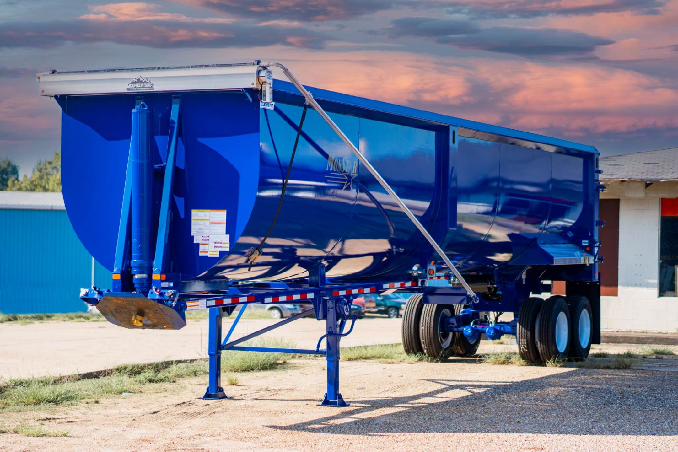 The Clement MonStar Frameless Steel Half Round Tandem End Dump Trailer